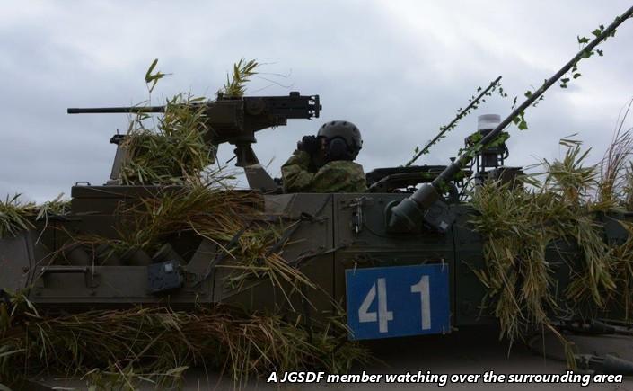A JGSDF member watching over the surrounding area